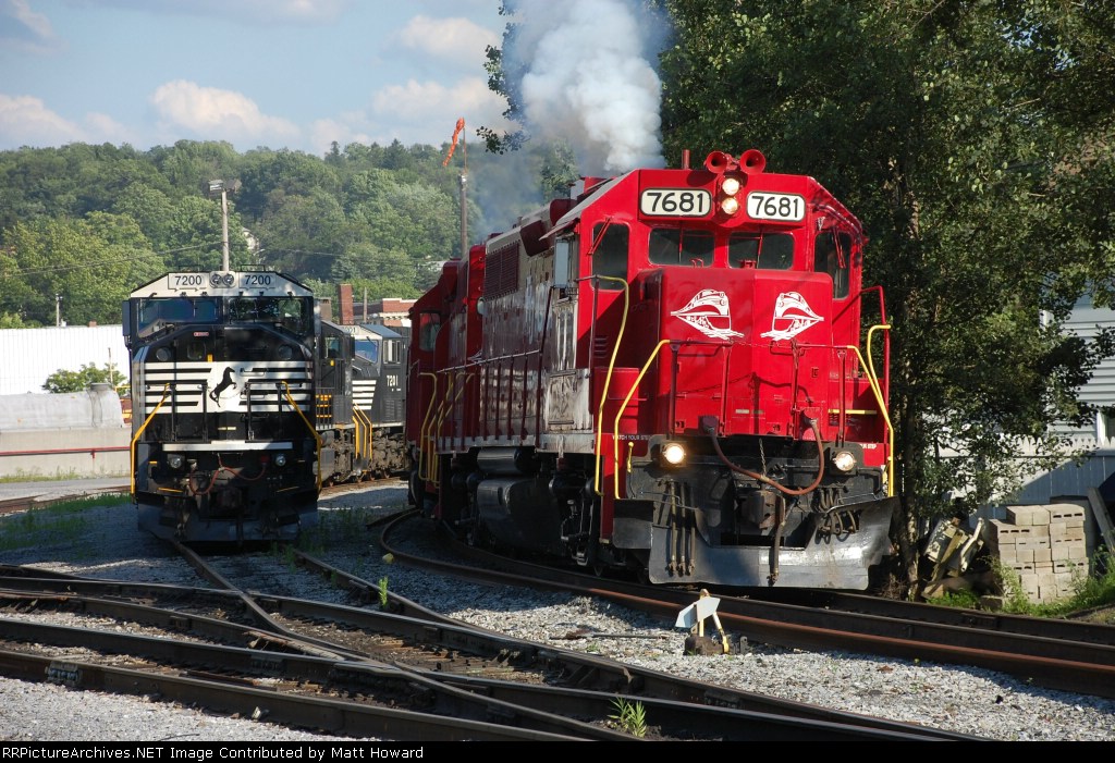 A well carbonned up GP38 heads west.